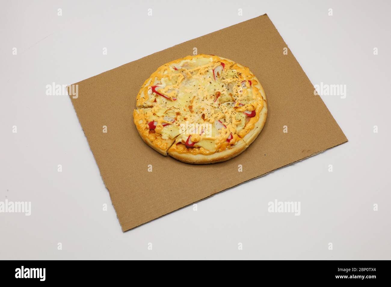 Pizza with chicken and sausage isolated on white background Stock Photo ...