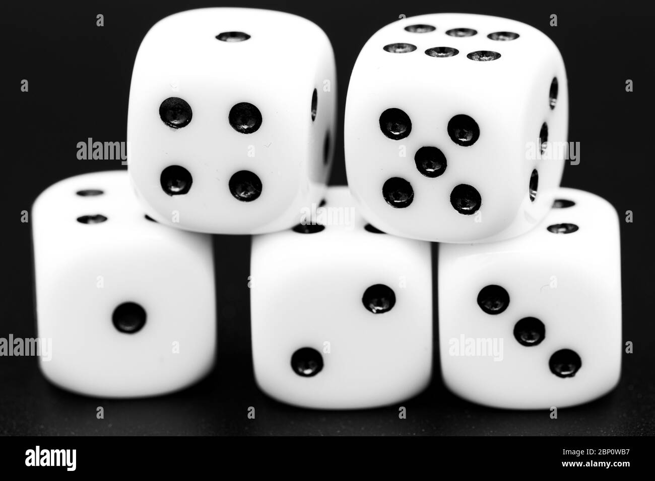 Macro closeup of five dice in front of dark background. Royalty free ...
