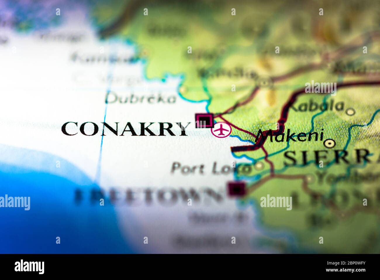 Shallow depth of field focus on geographical map location of Conakry ...