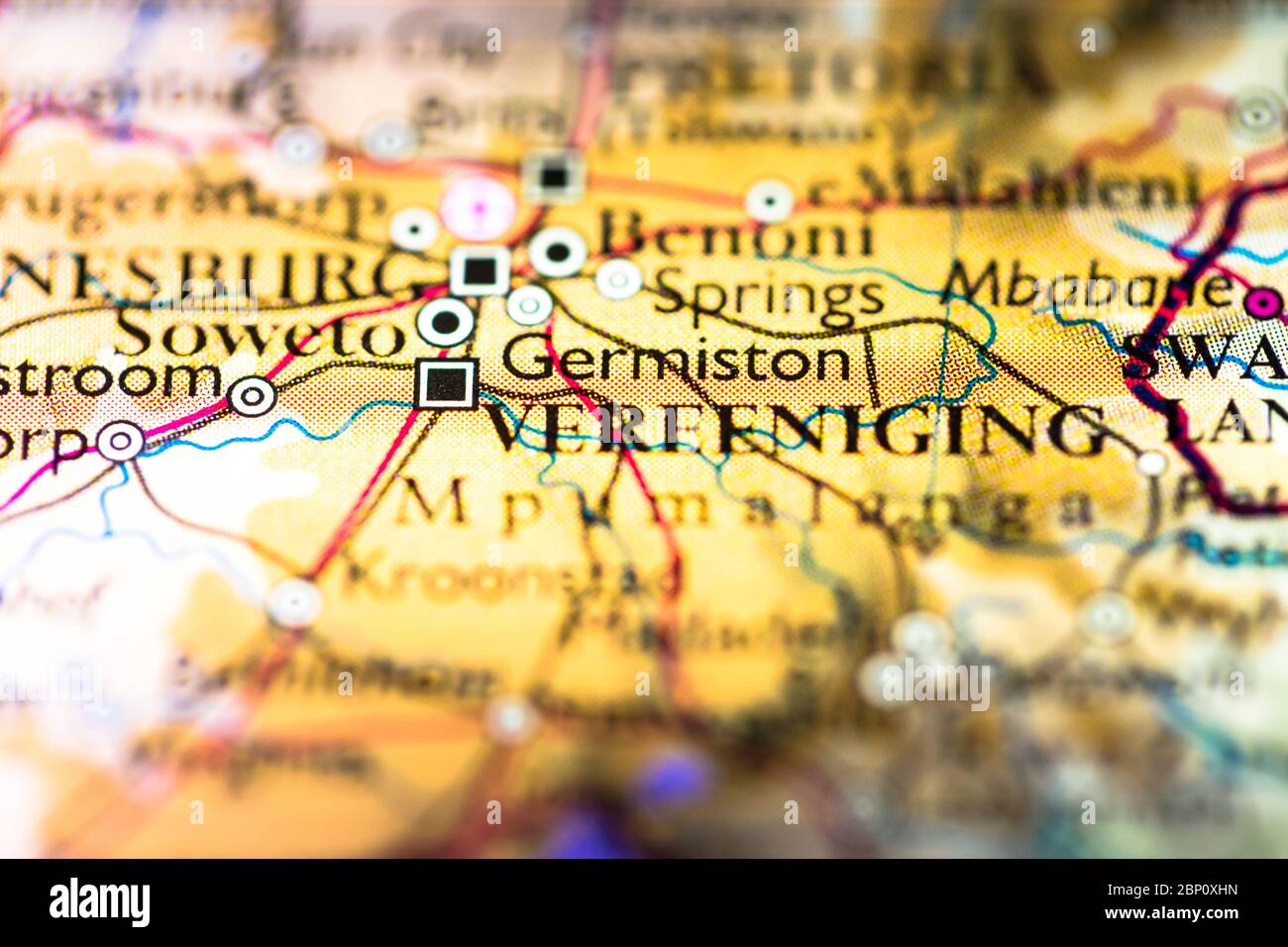 Shallow depth of field focus on geographical map location of ...