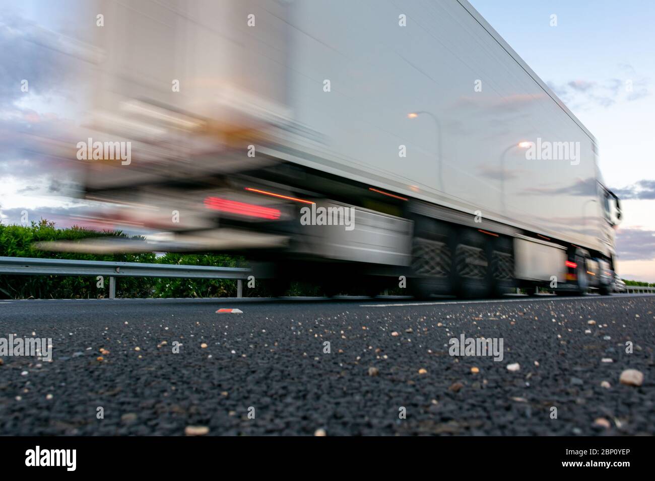 Moving truck driving on the highway at high speed Stock Photo - Alamy
