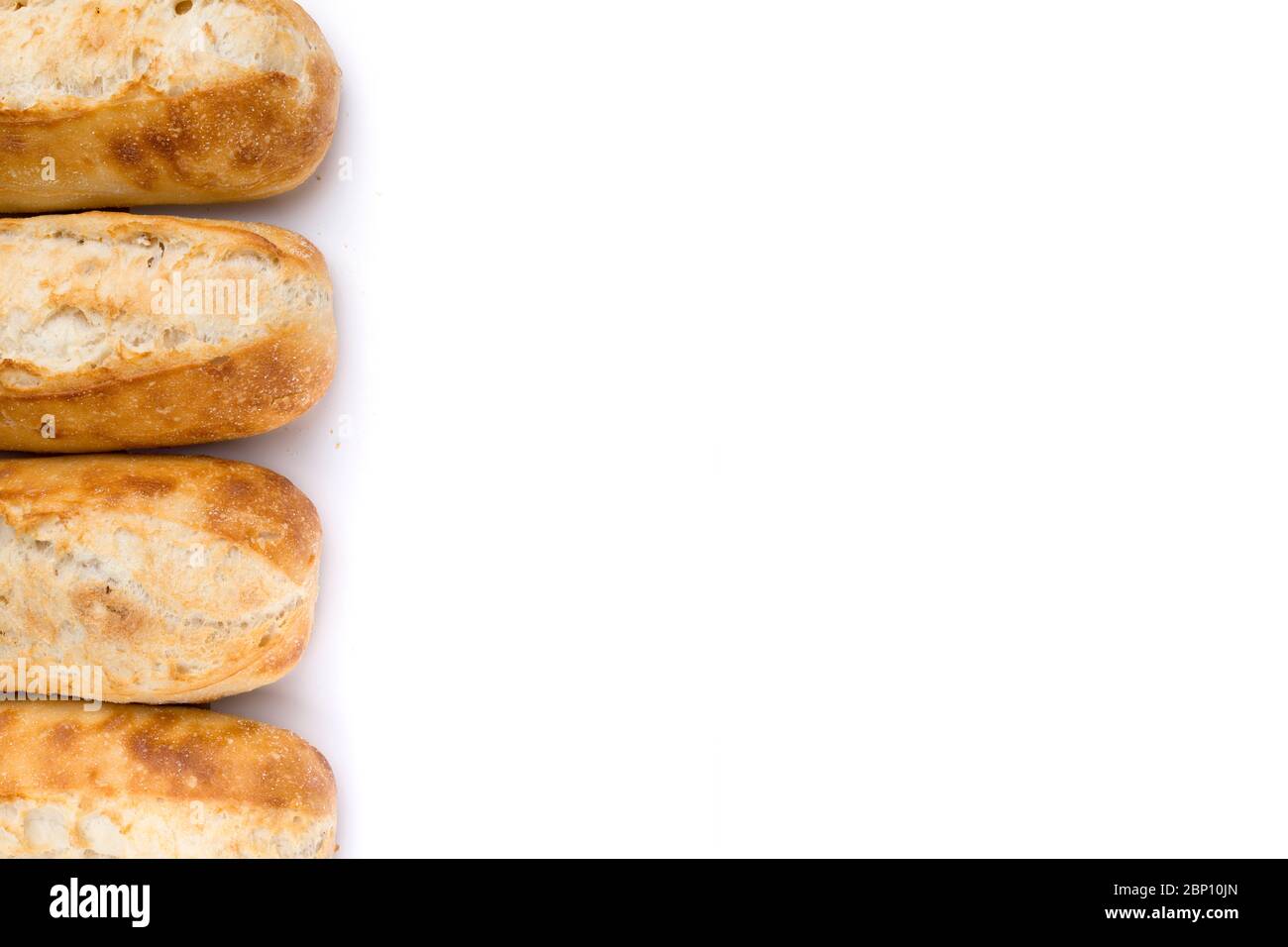 French bread rolls in a row with copy space Stock Photo - Alamy