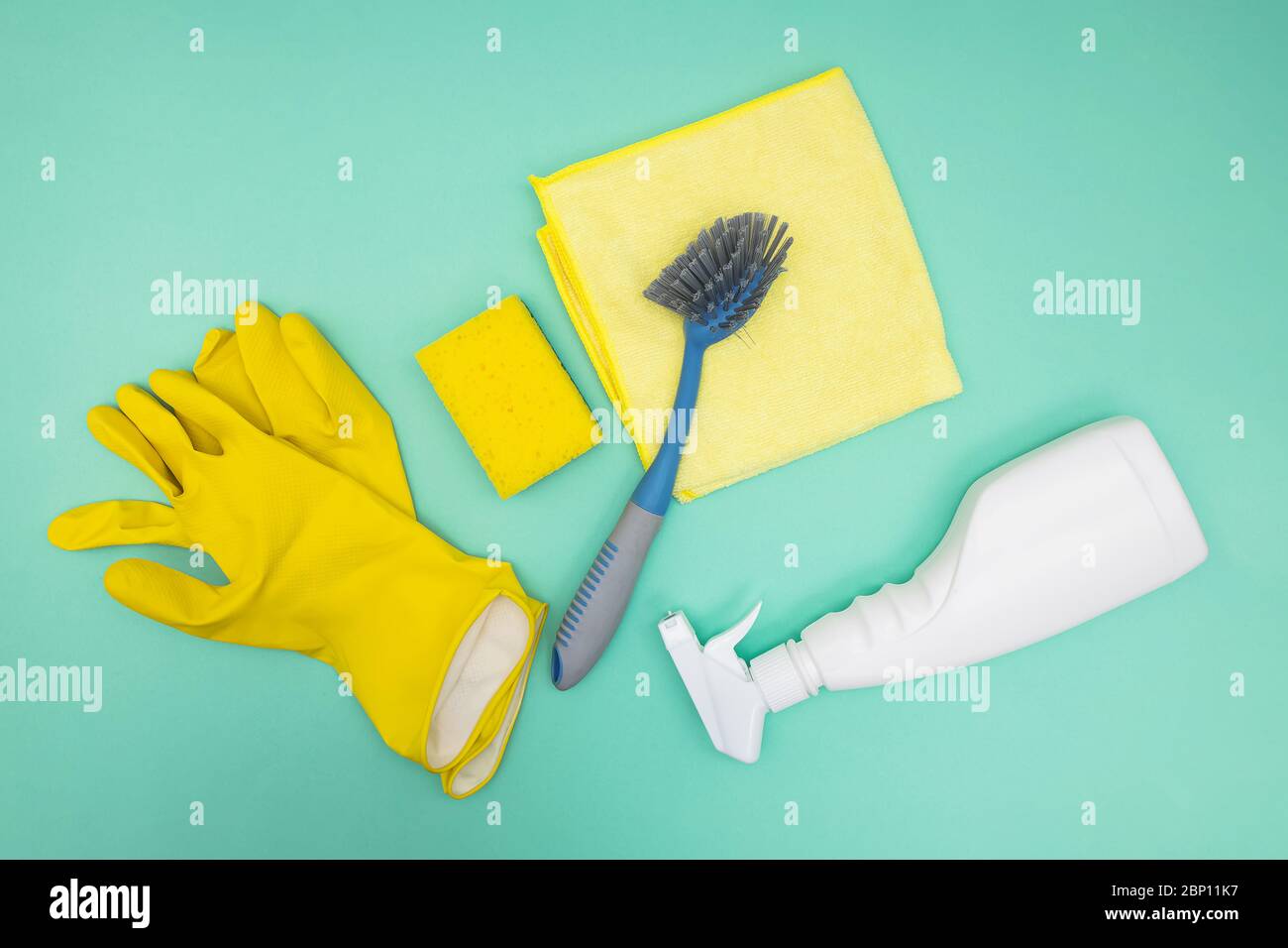 Cleaning tools and supplies on green background, top view Stock Photo ...