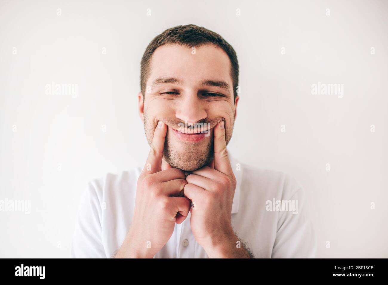 Young man isolated over white background. Facial portrait of guy ...