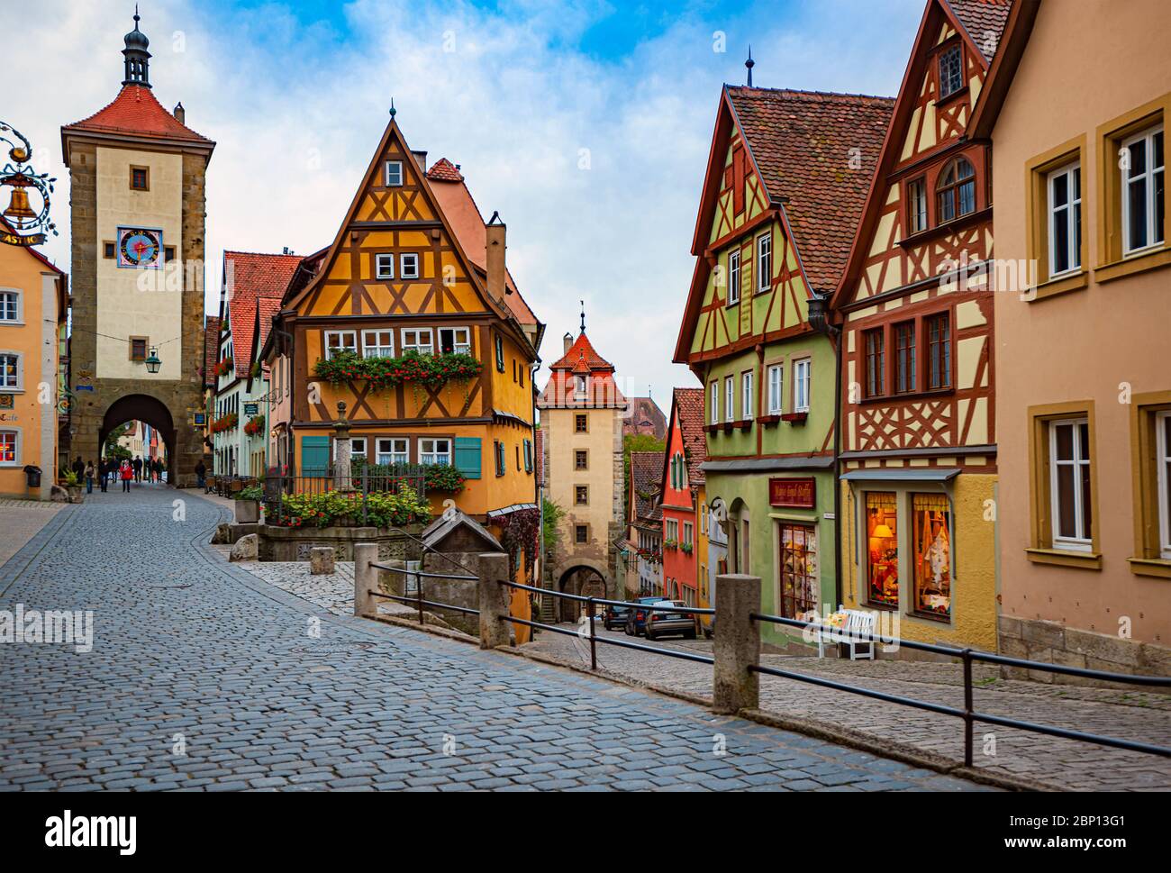 View on old city street with traditional architecture of Rothenburg Ob ...
