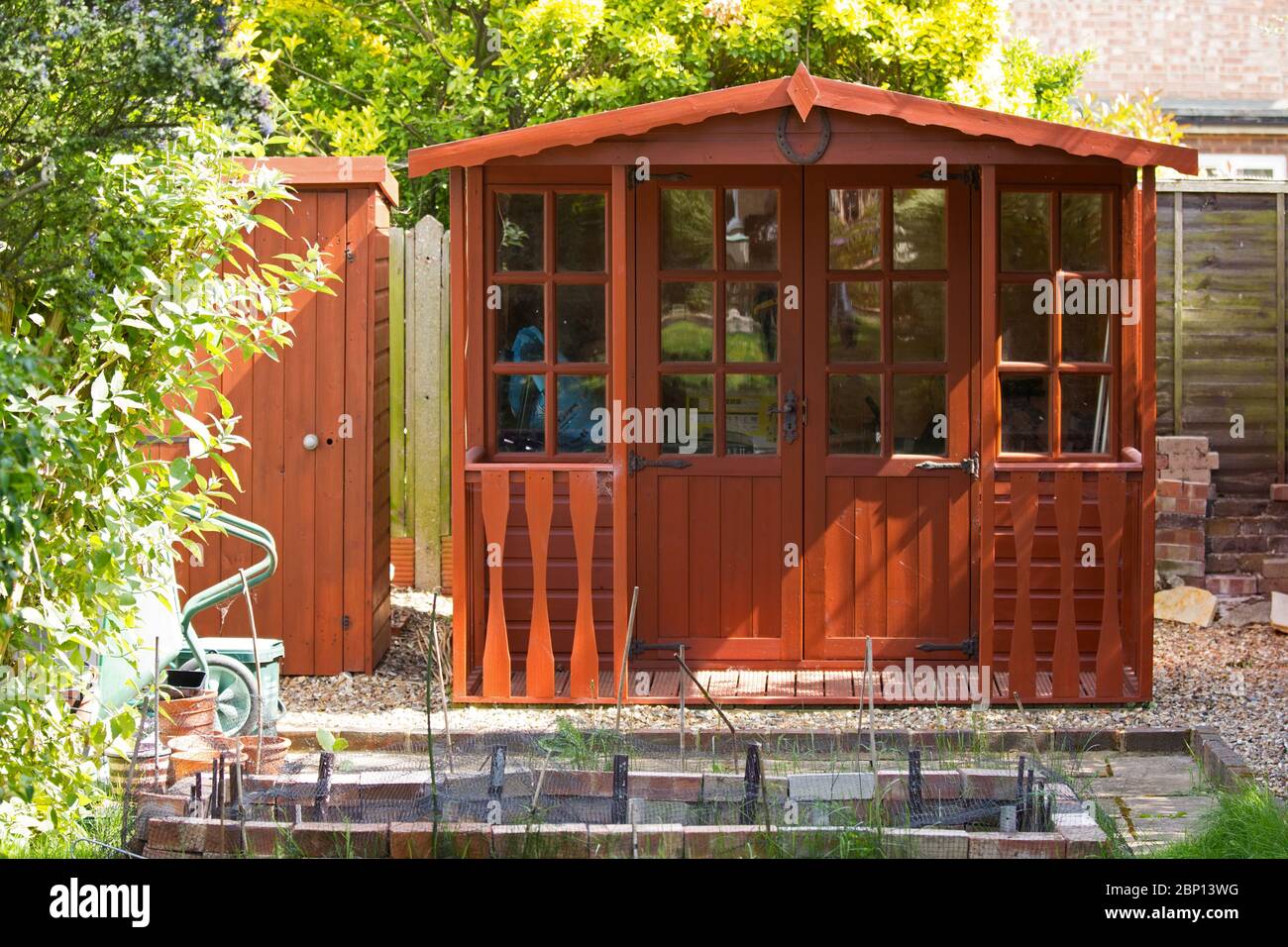 Garden red wooden house hi-res stock photography and images - Alamy