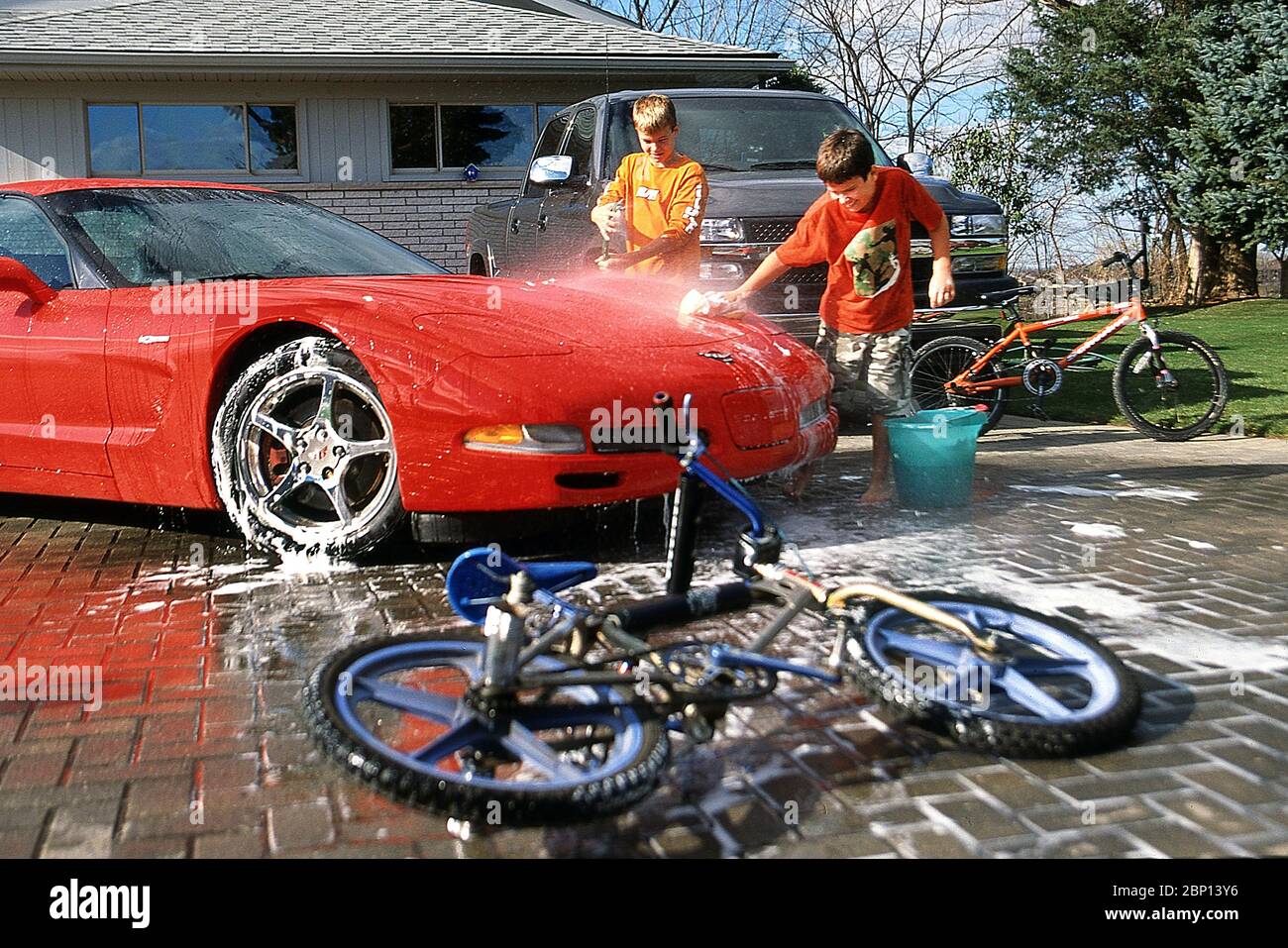 Two boy's washing a classic Chevrolet Corvette Stock Photo - Alamy