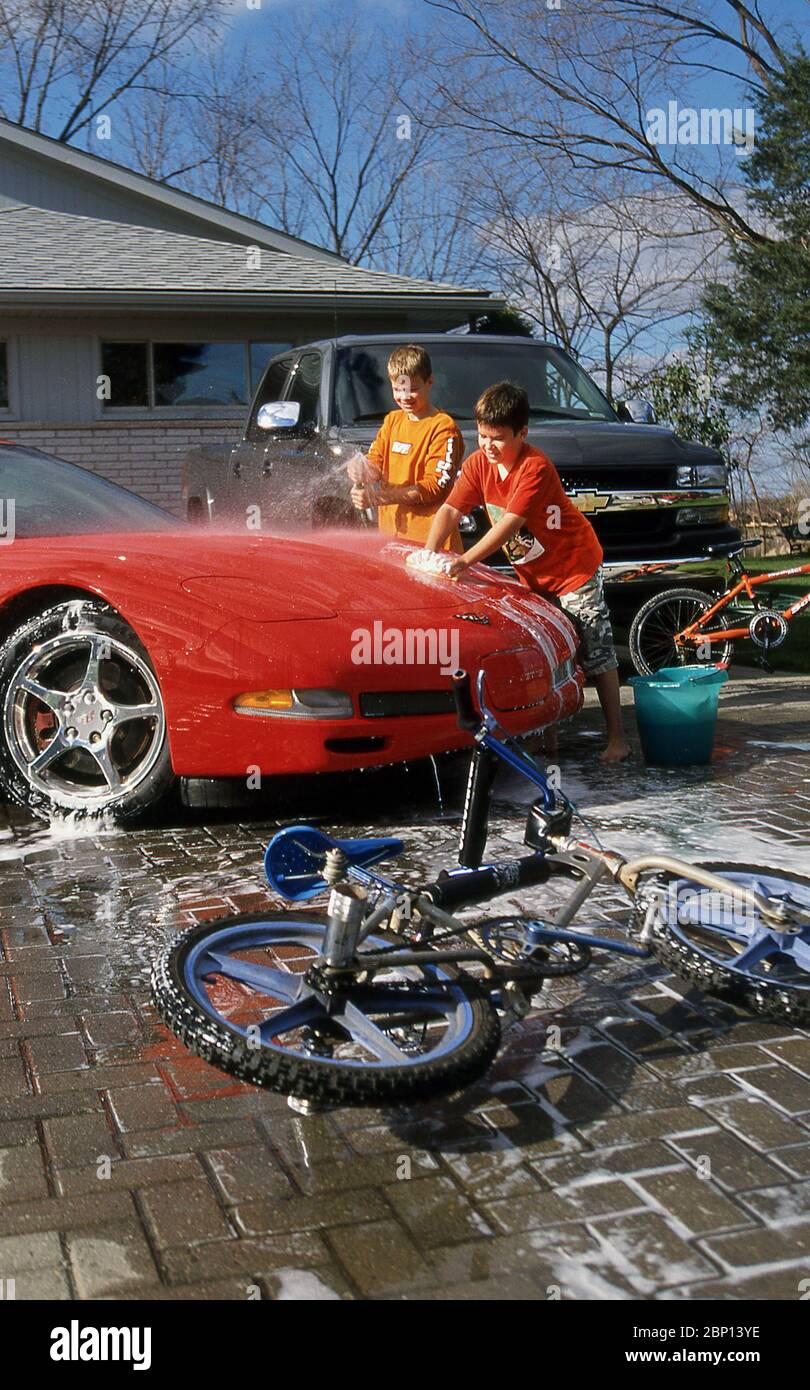 Two boy's washing a classic Chevrolet Corvette Stock Photo - Alamy