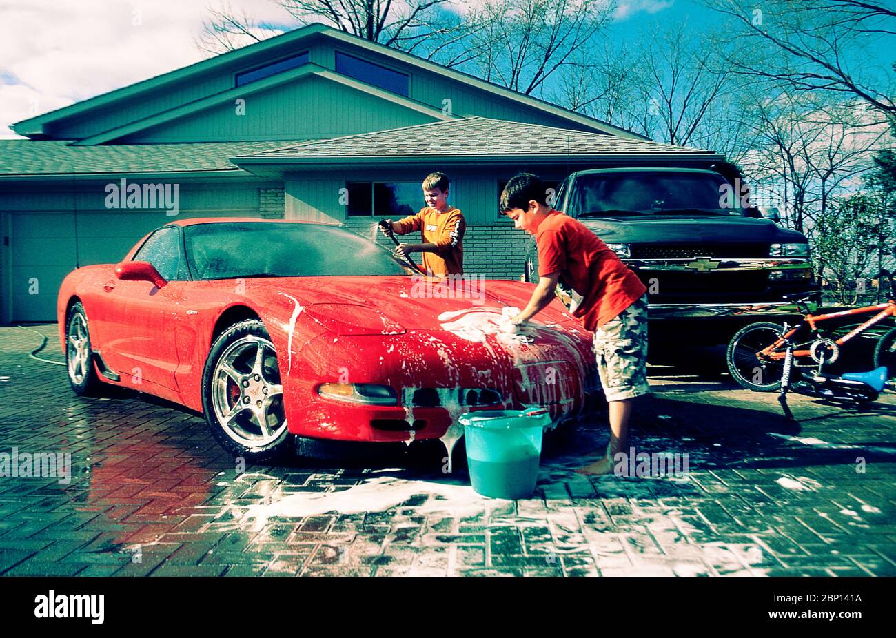 Two boy's washing a classic Chevrolet Corvette Stock Photo - Alamy