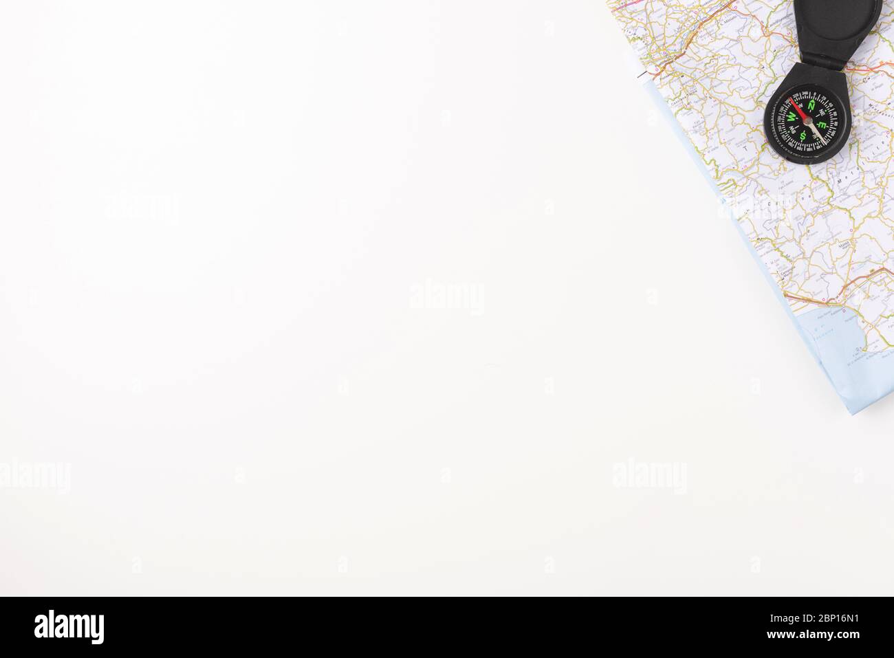 Flat lay travel map and compas on white background. travel concept ...