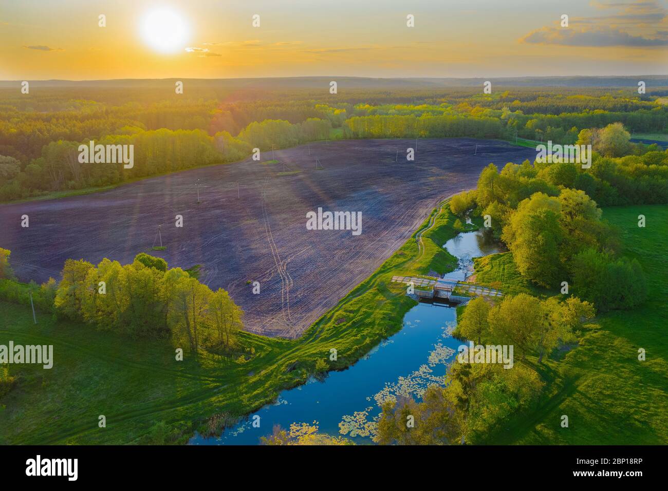 Sunset rural landscape with river and sky clouds. Evening Rural river ...