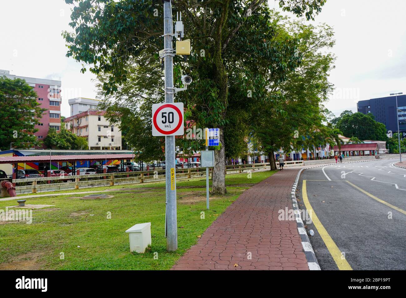 Sidewalk, road sign and beautiful nature of Bandar Seri Begawan, the ...