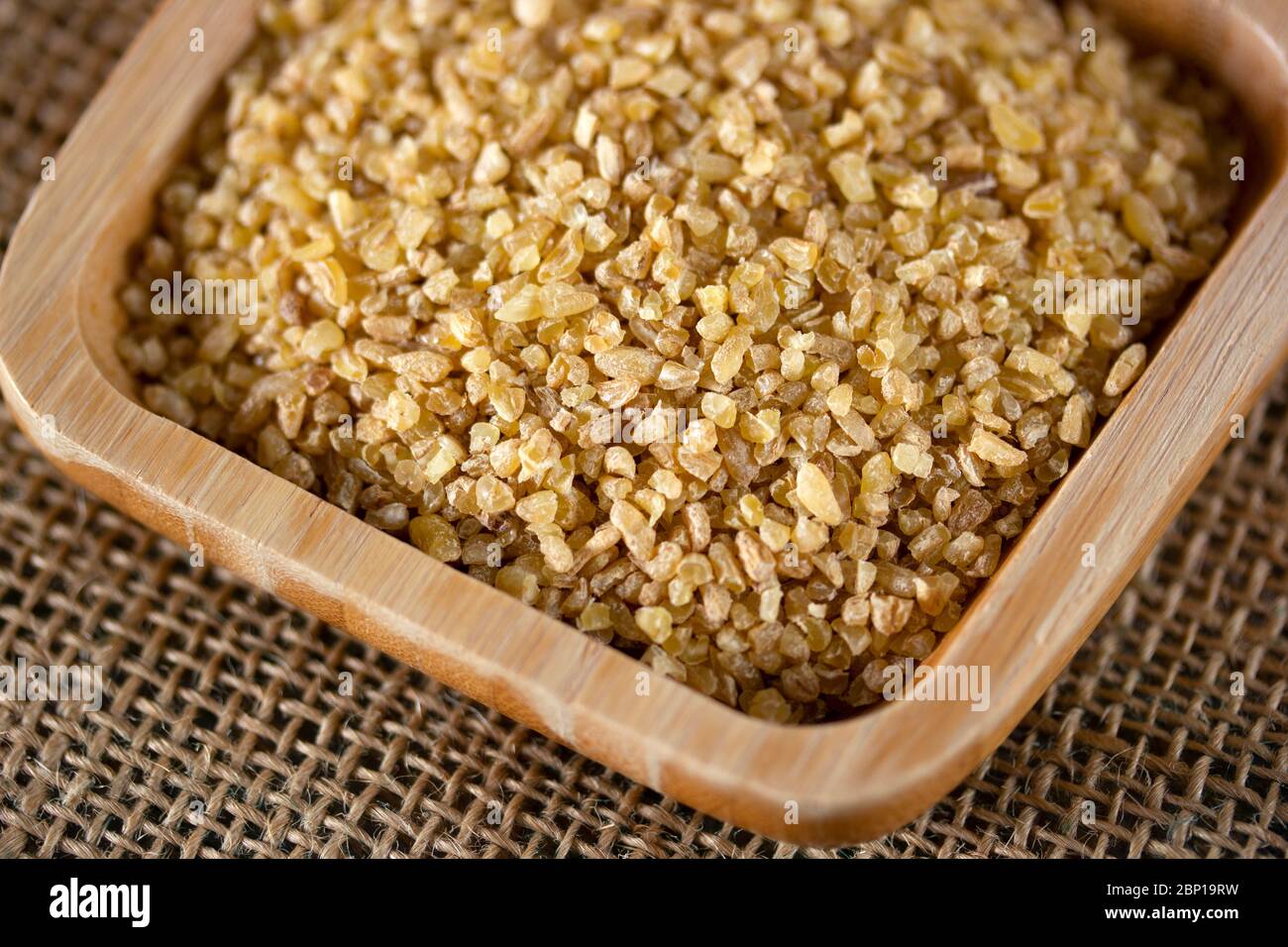 raw wheat grains in wooden platec Stock Photo - Alamy
