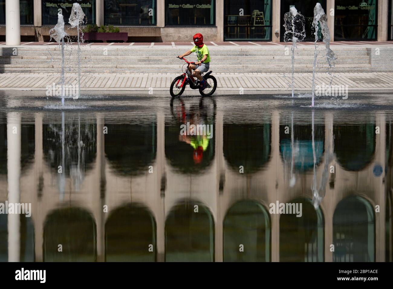 Spiderman face mask cycles through centenary square hi-res stock ...
