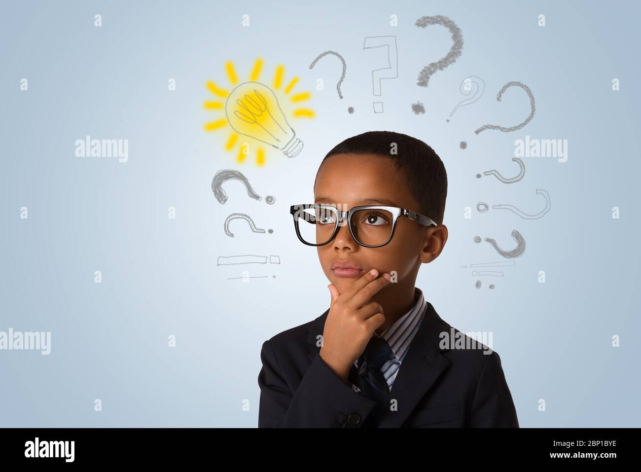 Adorable african little boy wearing glasses and thinking with many ...