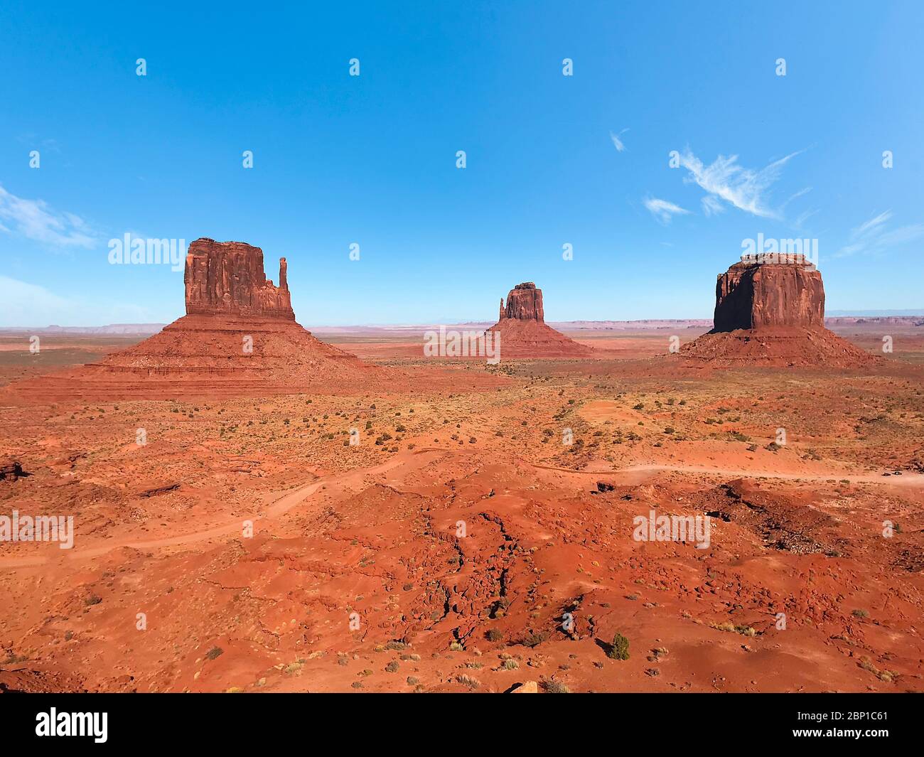 Amazing view of Monument Valley with red desert and blue sky and clouds ...