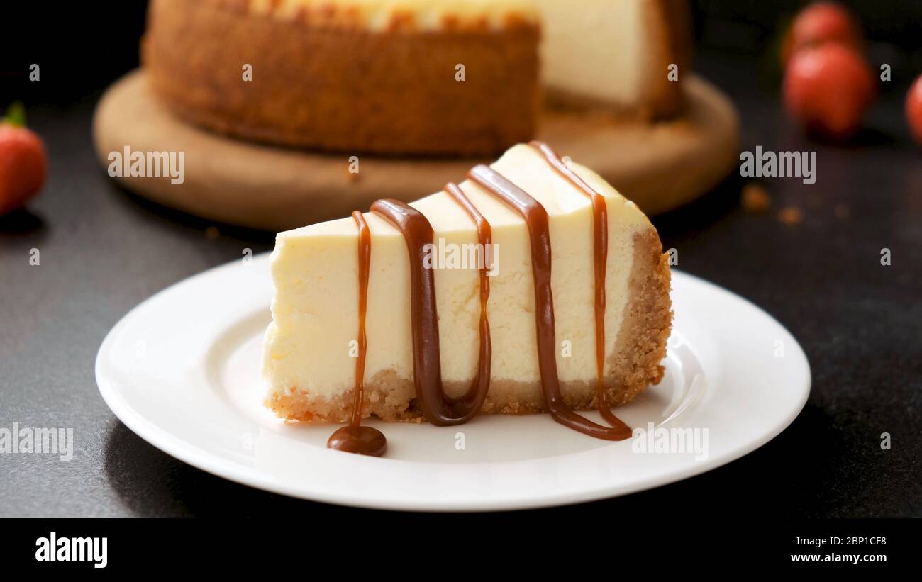 Cheesecake with caramel sauce on black background. Tasty homemade ...
