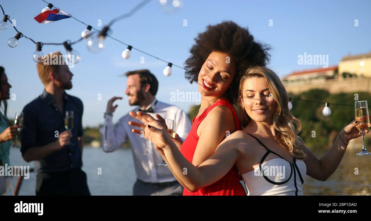 Group of friends having fun and celebrating group gathering outdoor ...