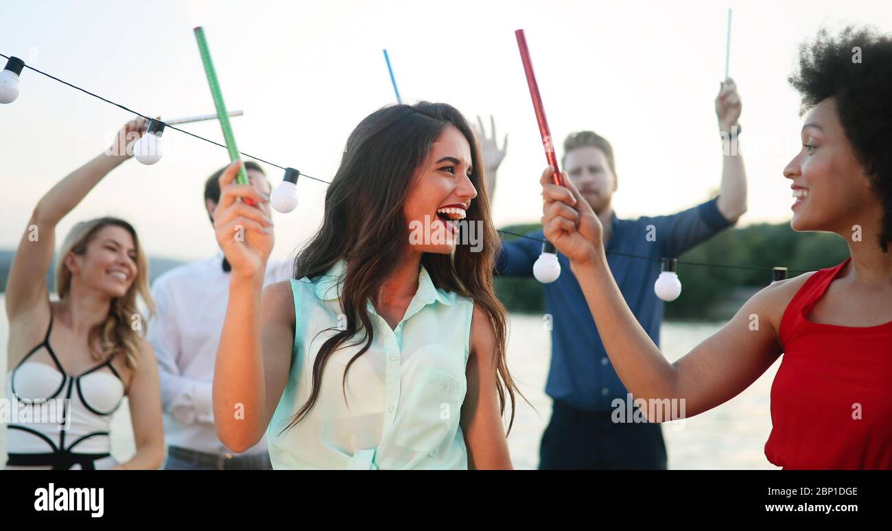Group of friends having fun and celebrating group gathering outdoor ...