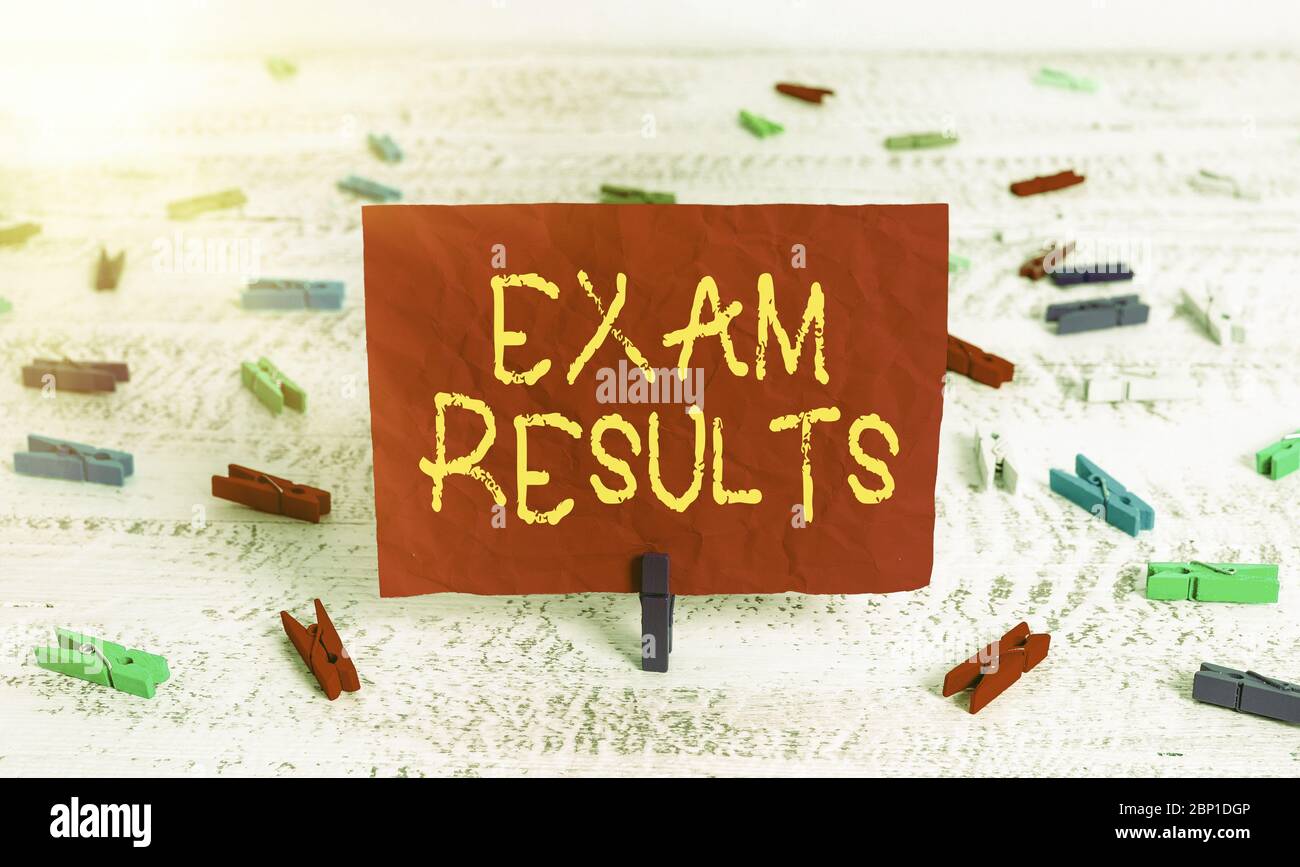 Writing note showing Exam Results. Business concept for An outcome of a ...