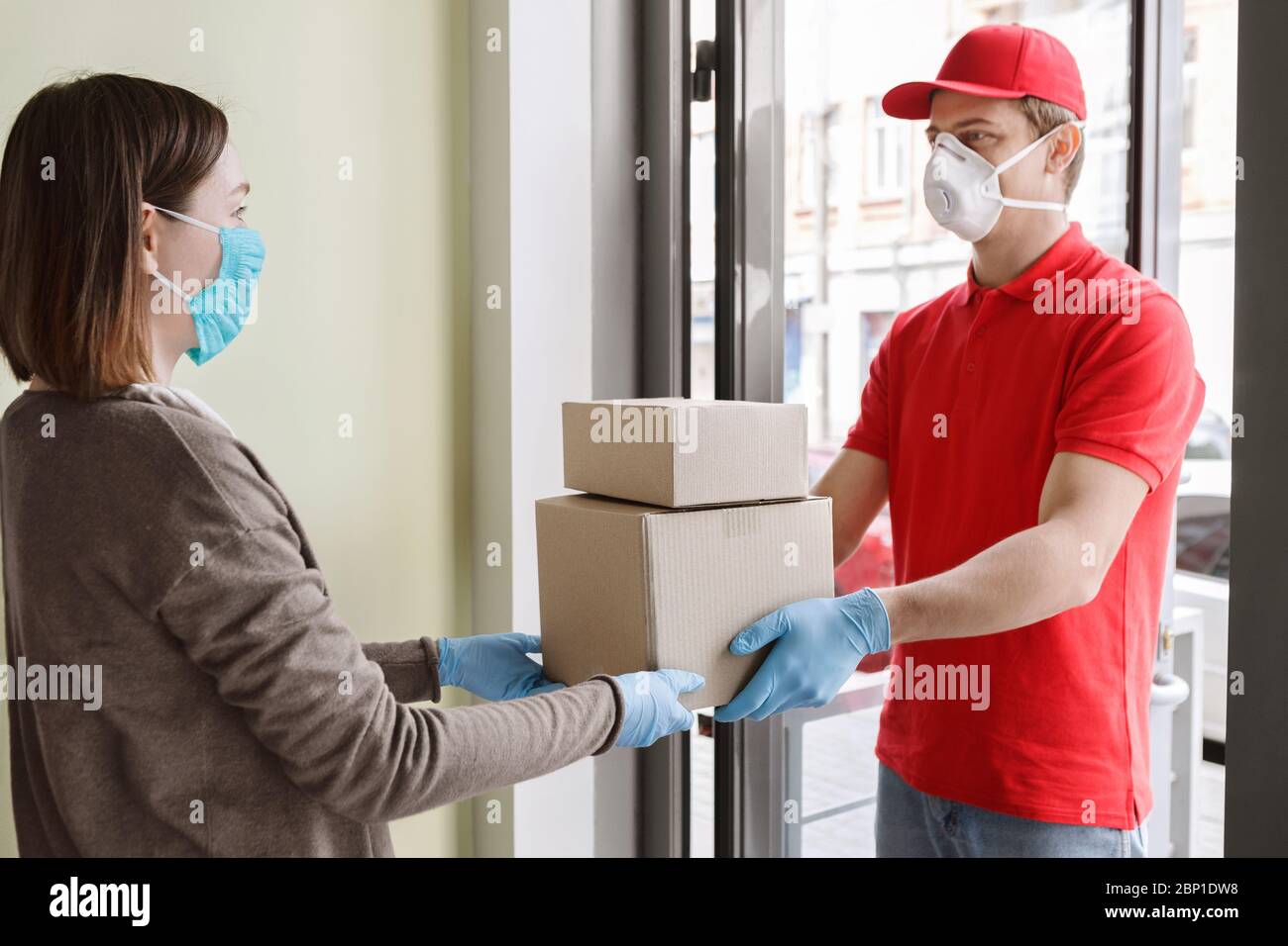 Handing over parcels from hand to hand at home concept Stock Photo - Alamy