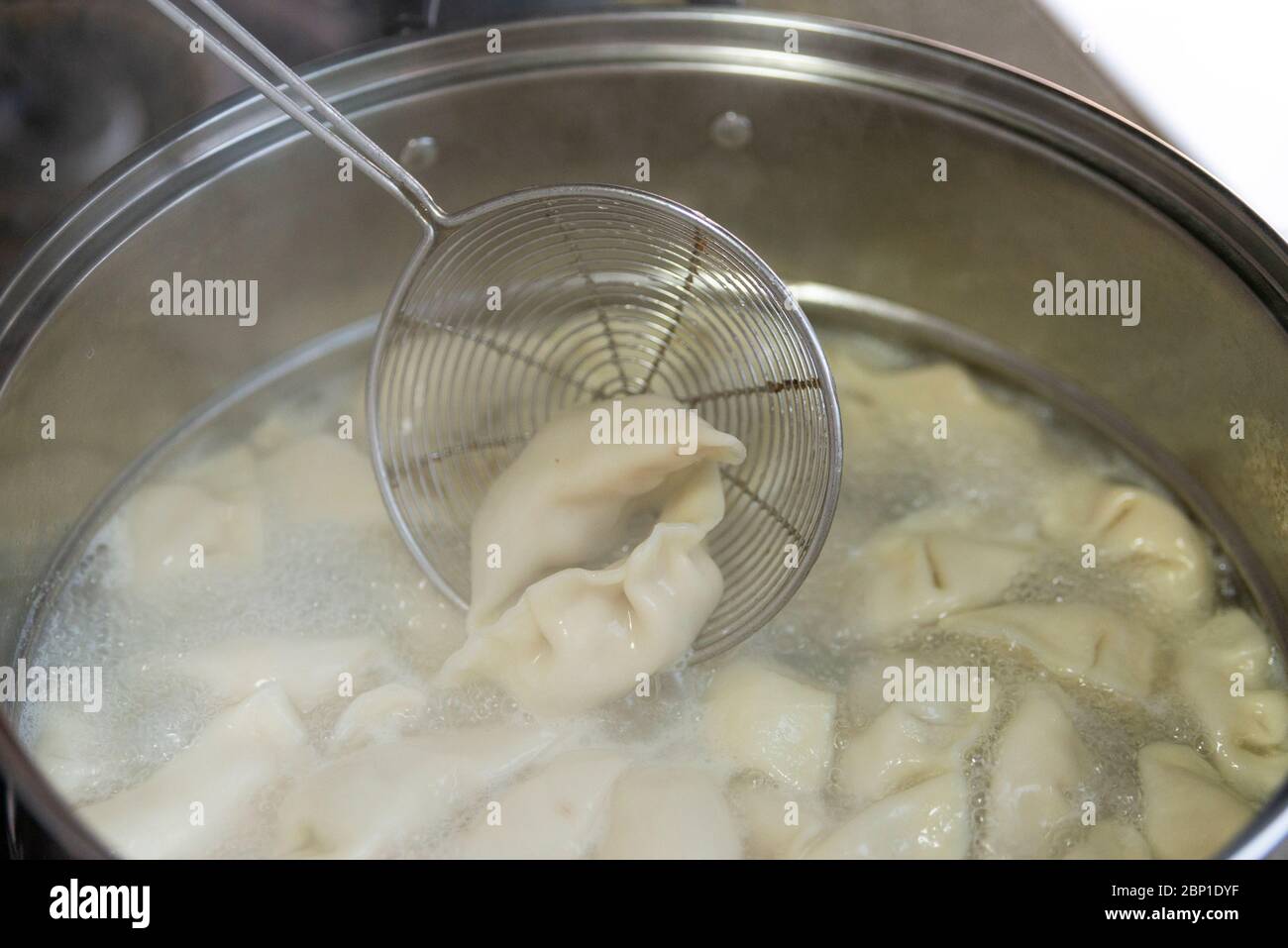 Broth soup ravioli dumplings hi-res stock photography and images - Alamy