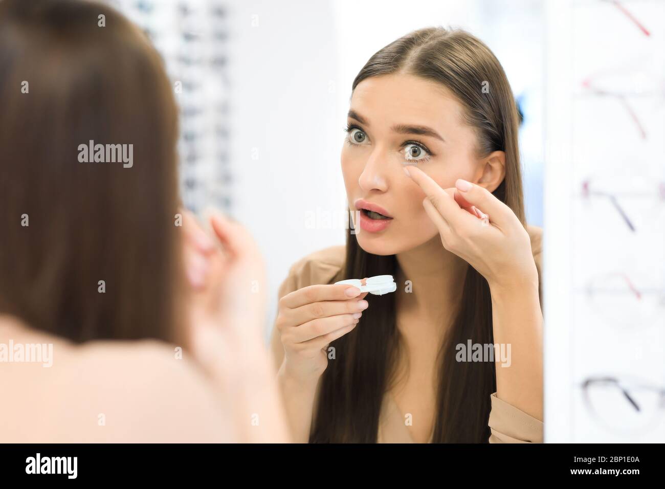 Lenses woman hi-res stock photography and images - Alamy