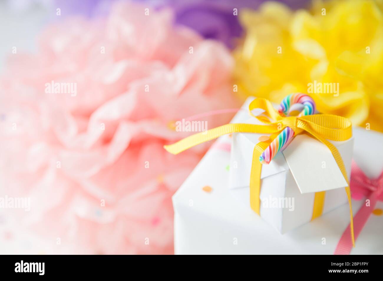 Colored small gift boxes with colorful ribbons Stock Photo - Alamy