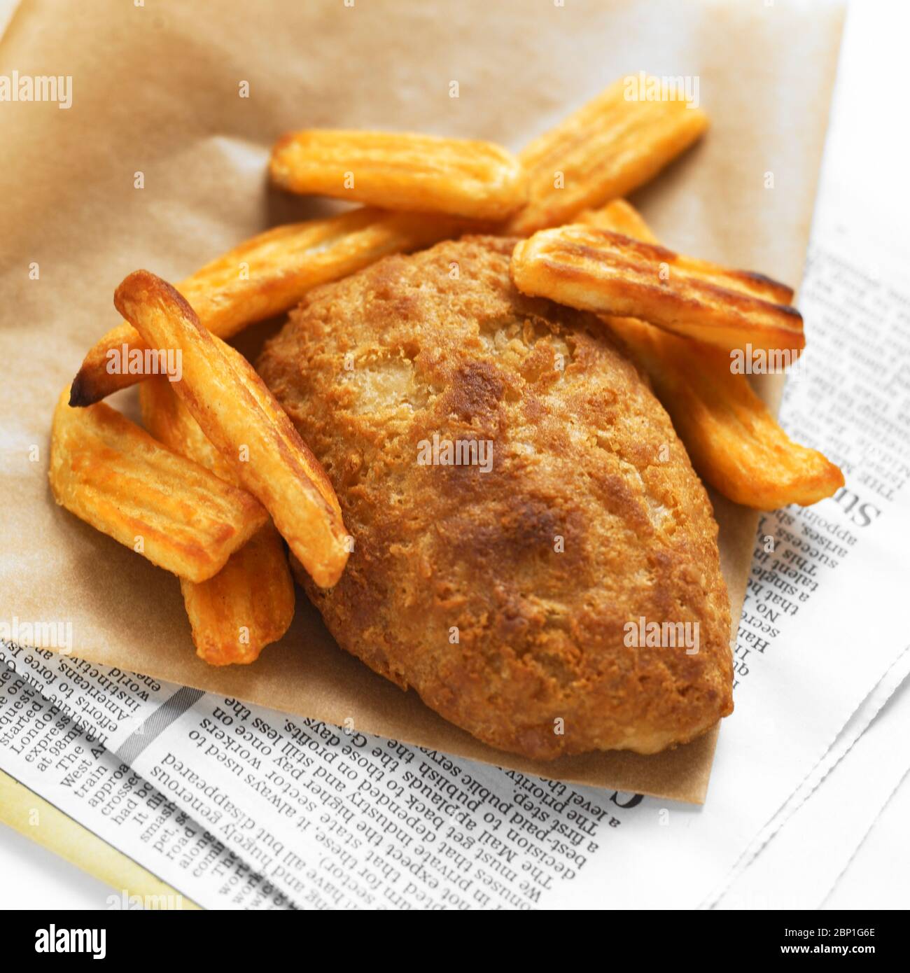 Battered Haddock Fillet with Beer Batter Chips on Newspaper Stock Photo ...