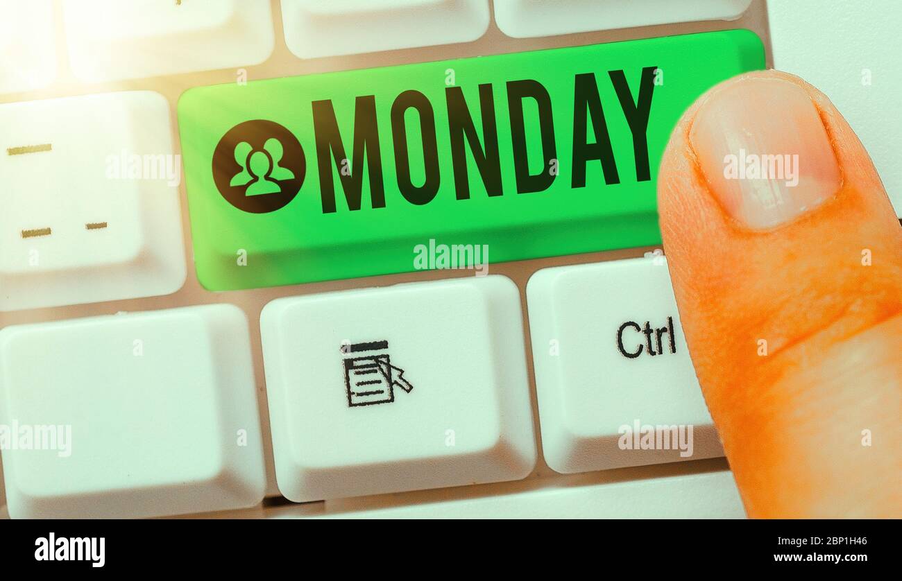 Writing note showing Monday. Business concept for the day of the week ...