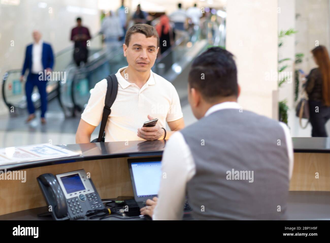 The man at the reception in the hotel Stock Photo - Alamy