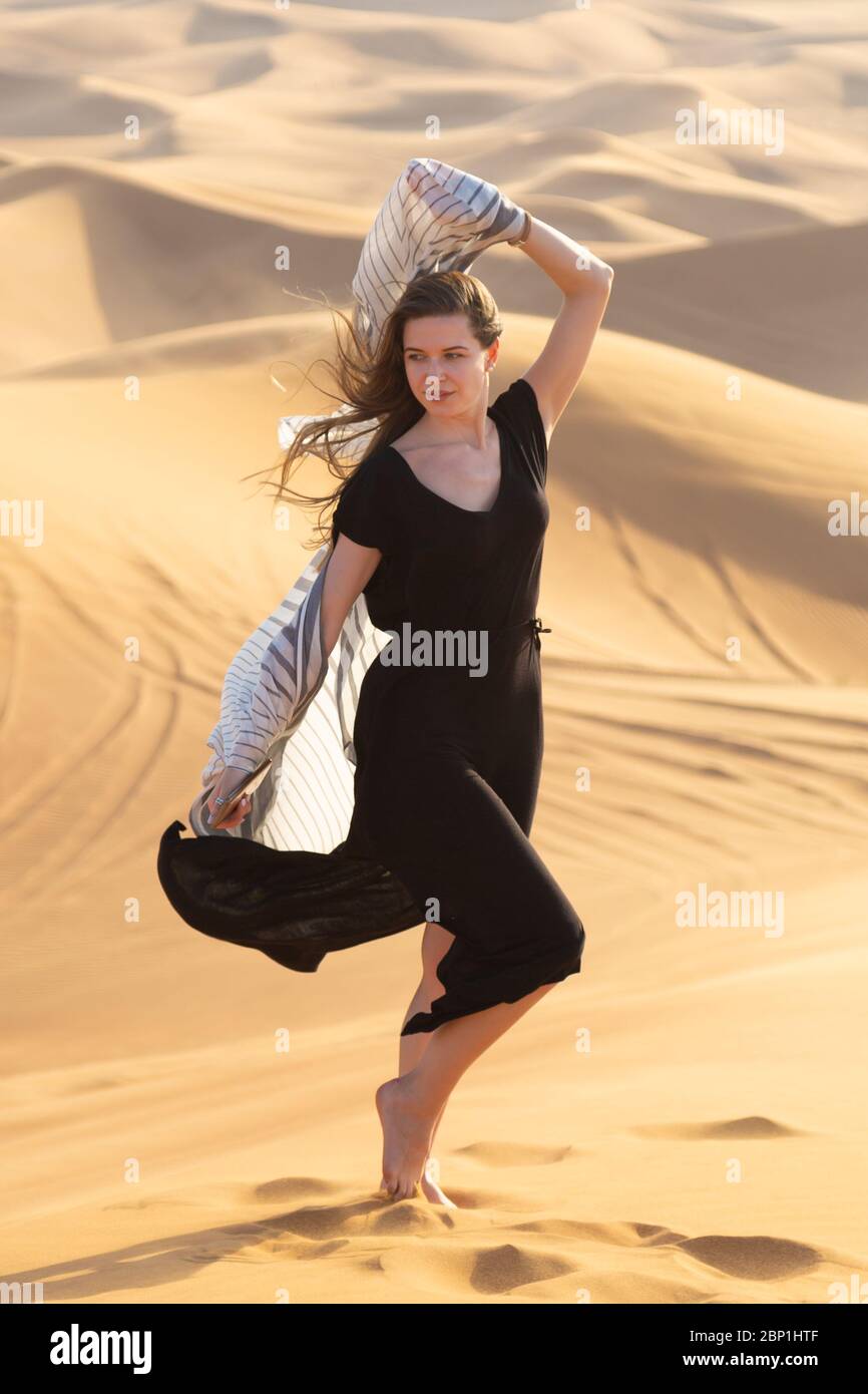 Girl model poses for the photographer in the desert Stock Photo - Alamy