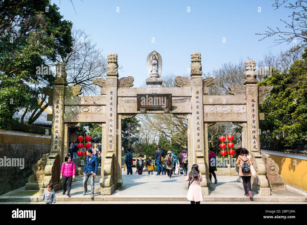 Tourtists at the archway at the Mount Luojia, which lies in the Lotus ...