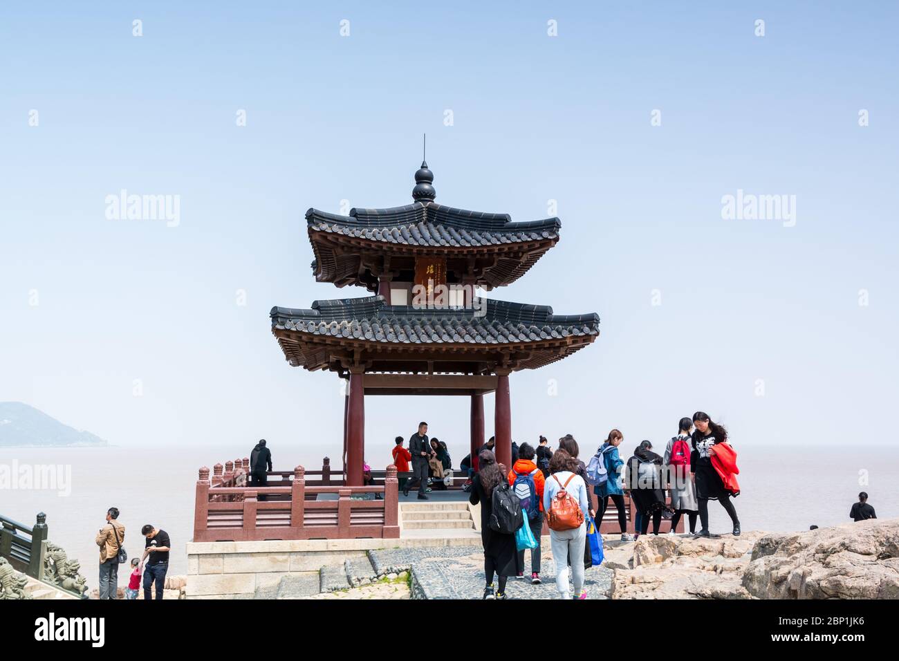 Tourists at the pavilion in Mount Luojia, which lies in the Lotus Sea ...