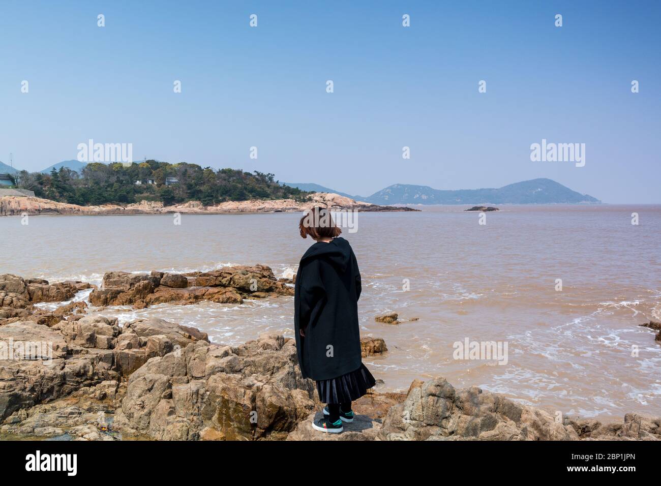 Tourist at the seaside at Mount Luojia, which lies in the Lotus Sea to ...