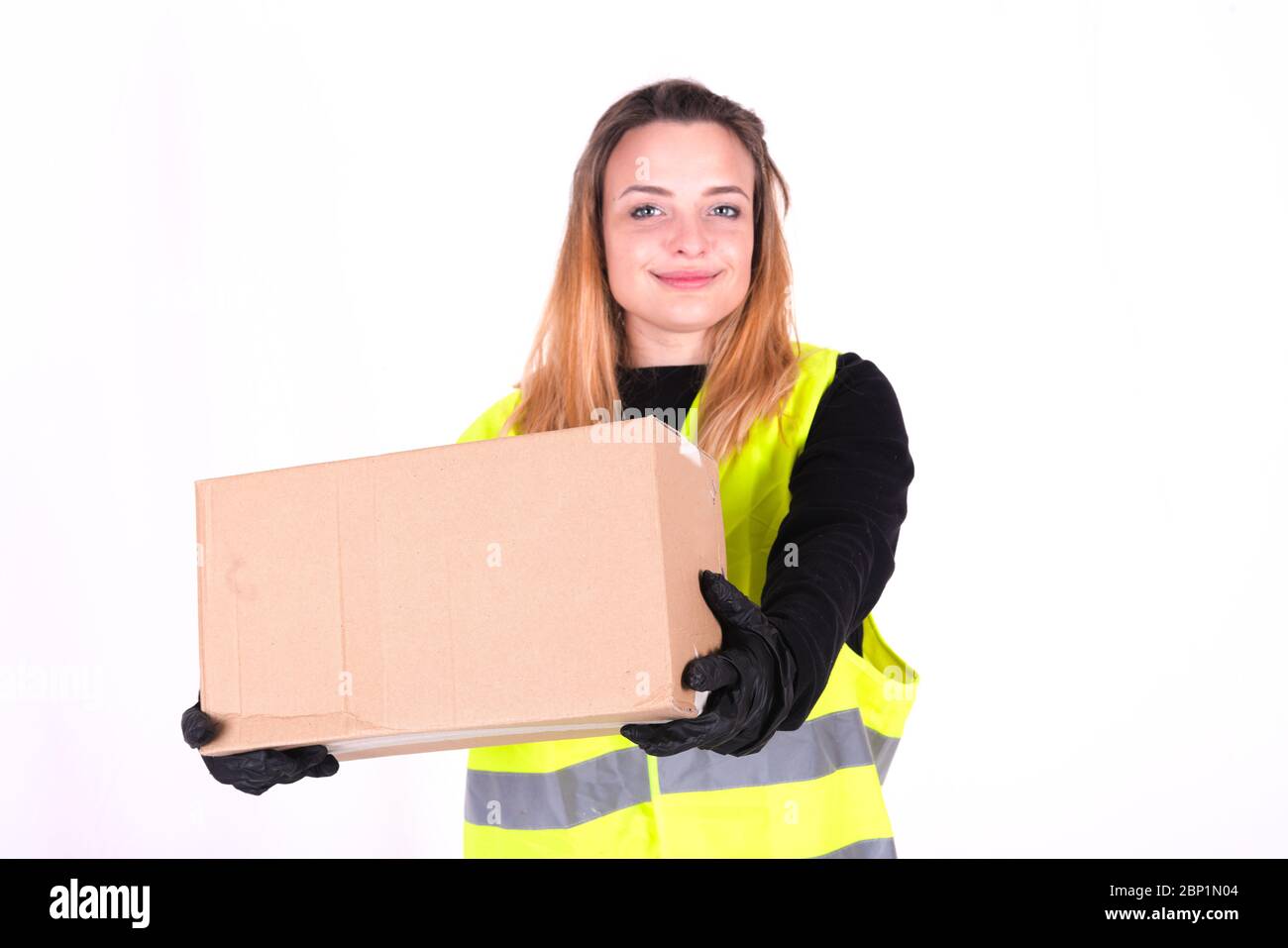 postman with yellow giachet worker in the white background Stock Photo ...