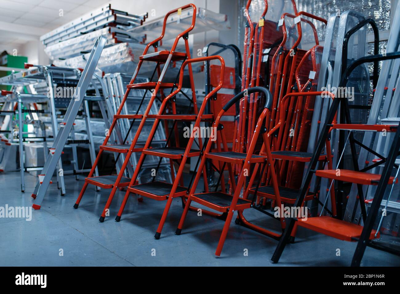 New aluminum stepladders in tool store, nobody Stock Photo - Alamy