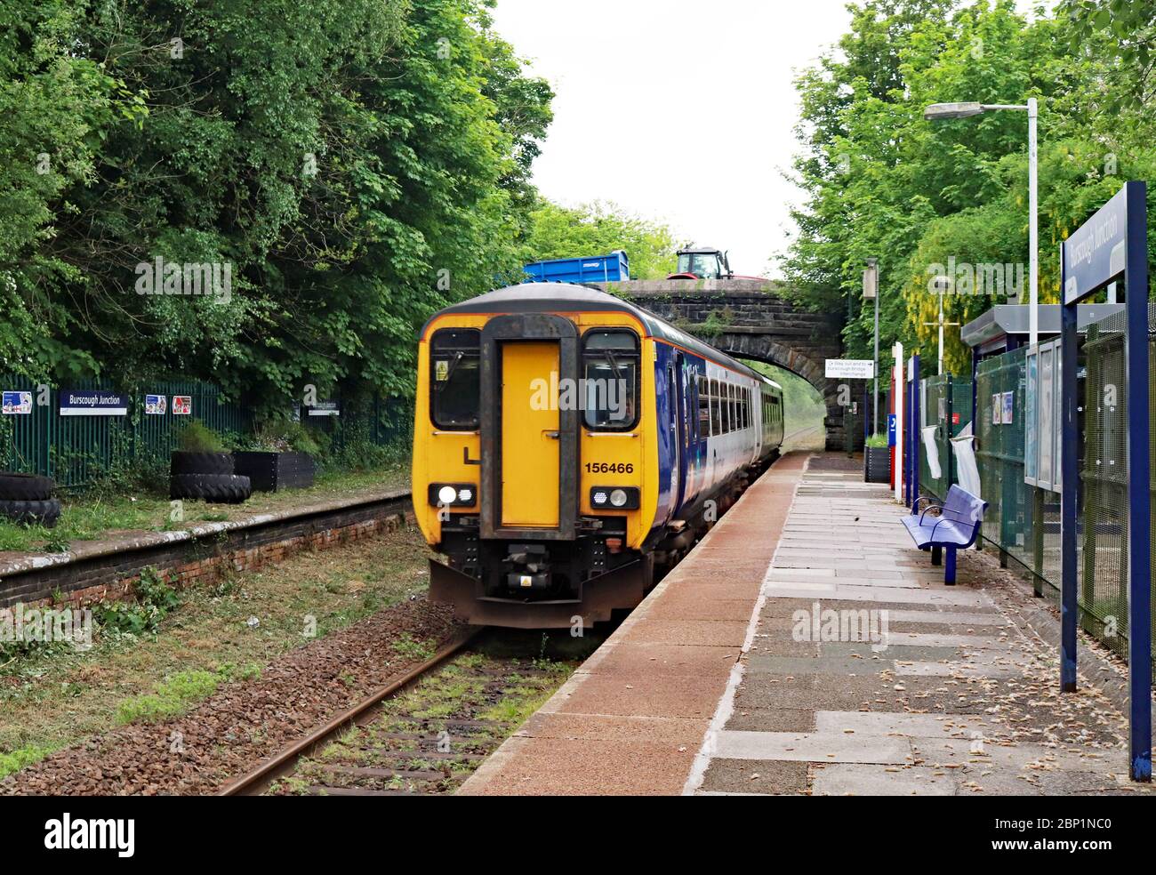A train passes through Burscough Junction station with a route ...