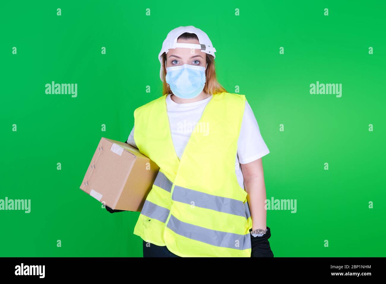 postman with yellow giachet worker in the green background Stock Photo ...