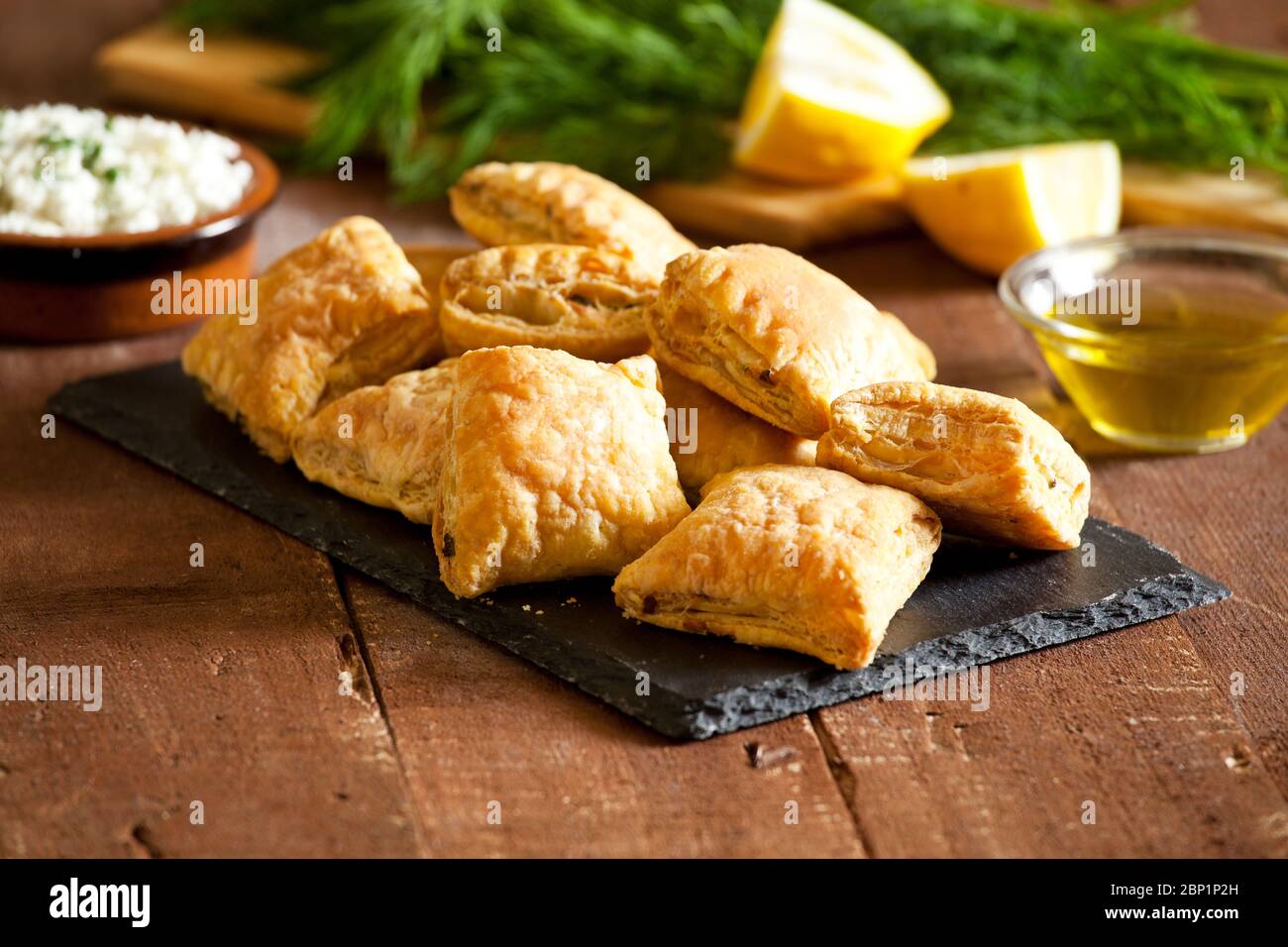 Platter of small homemade greek cheese pies with feta cheese Stock ...