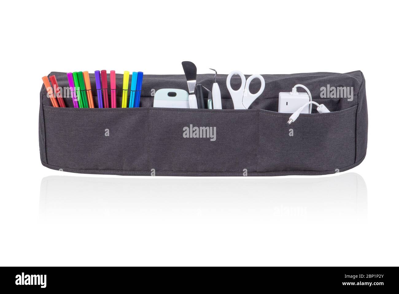 Gray cutting machine cover with all the stationery accessories isolated ...