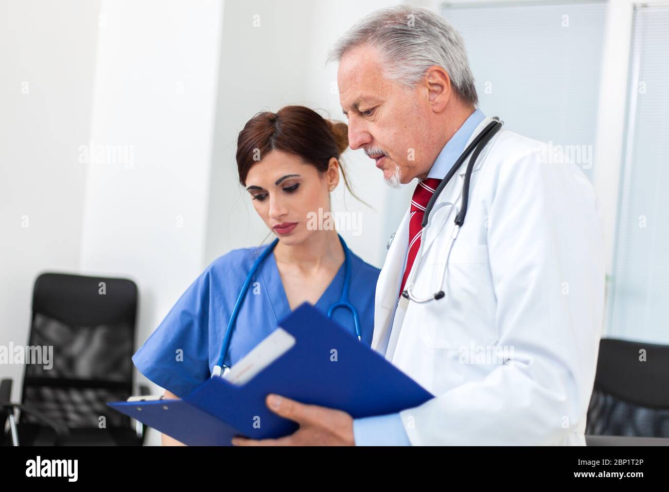 Doctor senior couple talk hi-res stock photography and images - Alamy