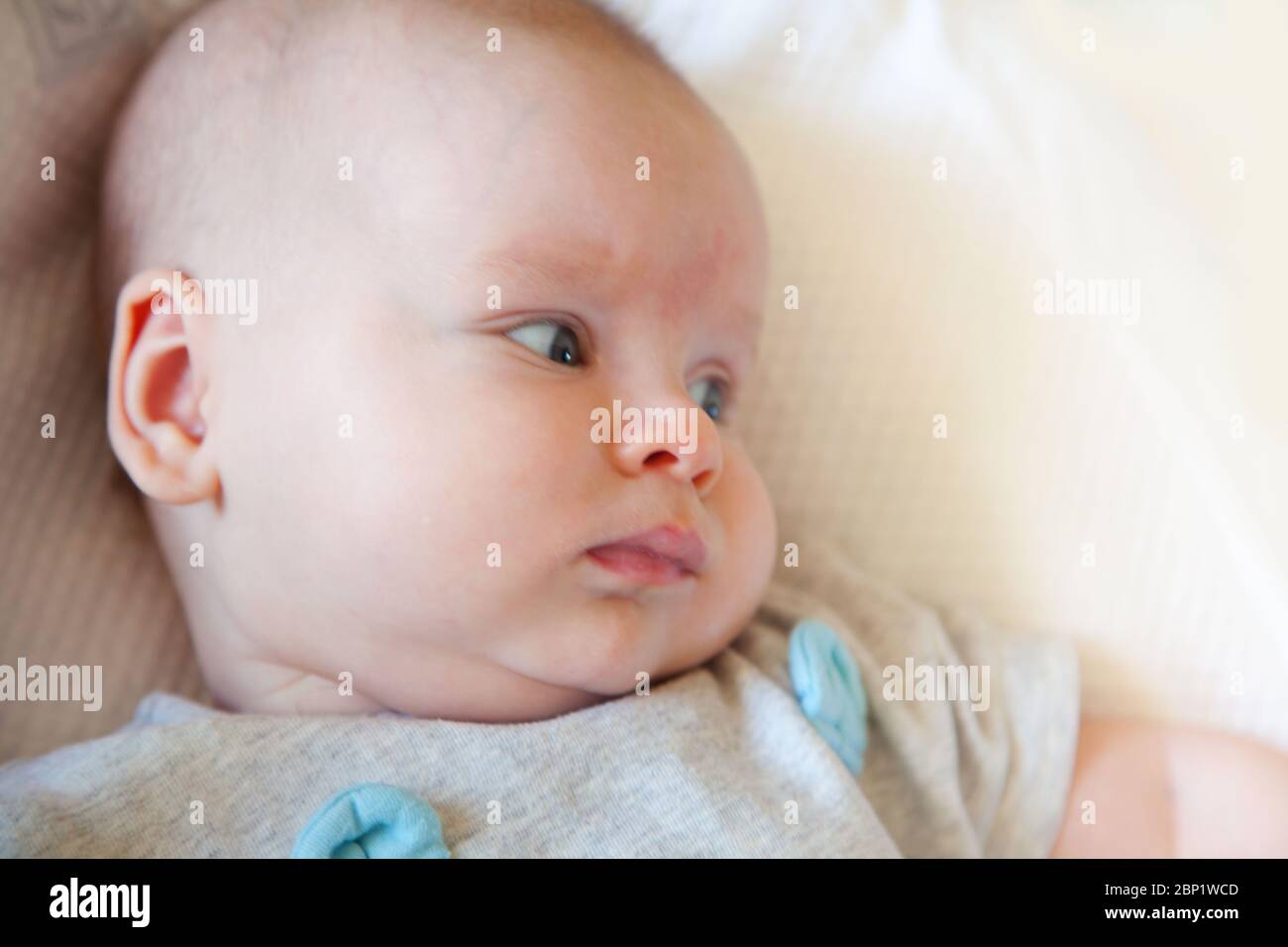 newborn baby, yellow background Stock Photo - Alamy