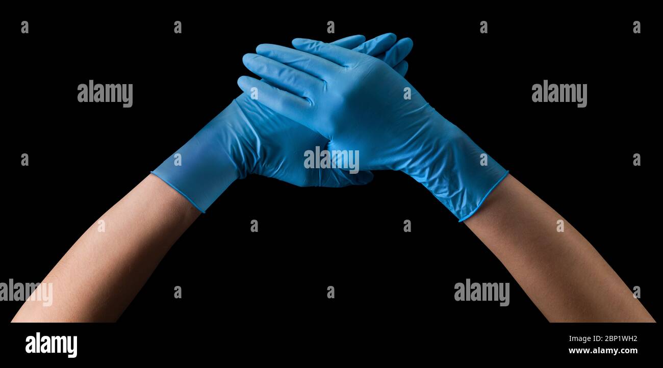 Doctor's hand in sterile medical gloves hold each other isolated on ...