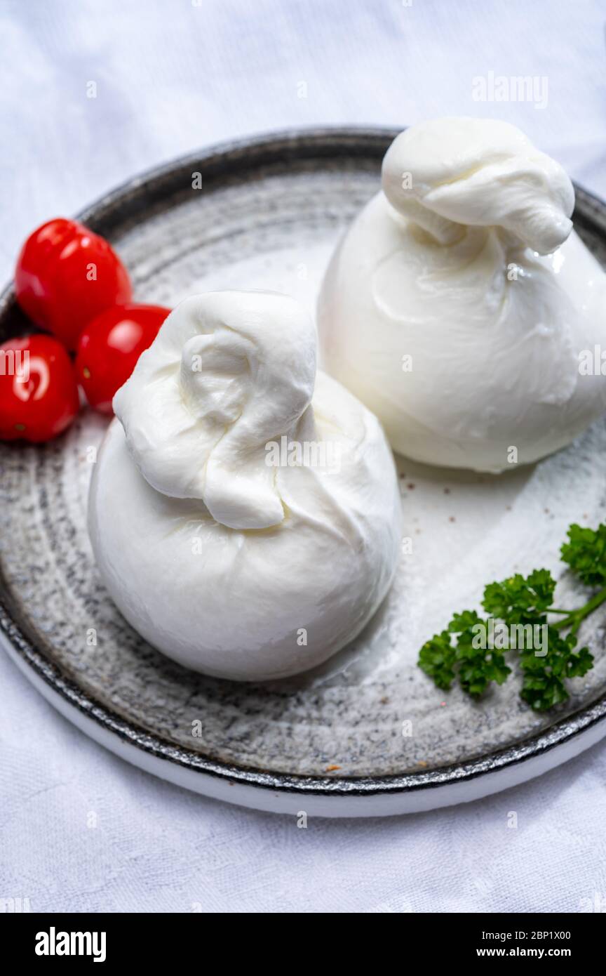 Cheese collection, fresh soft white burrata cheese ball made from ...