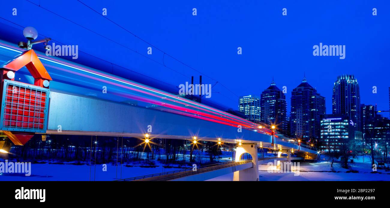 Calgary C-Train entering downtown with colorful light trails Stock ...