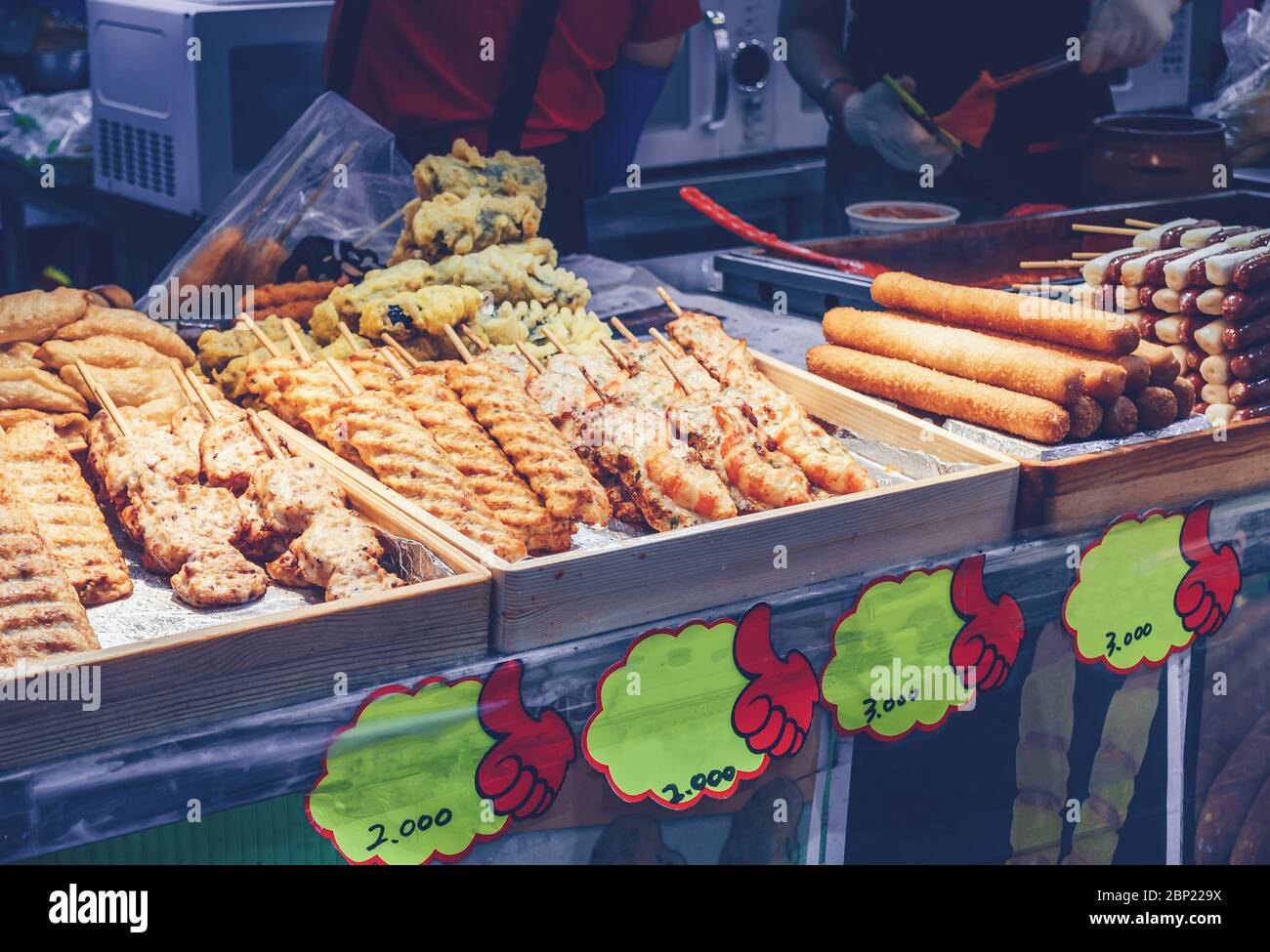 fried korean street food on display for sale Stock Photo - Alamy