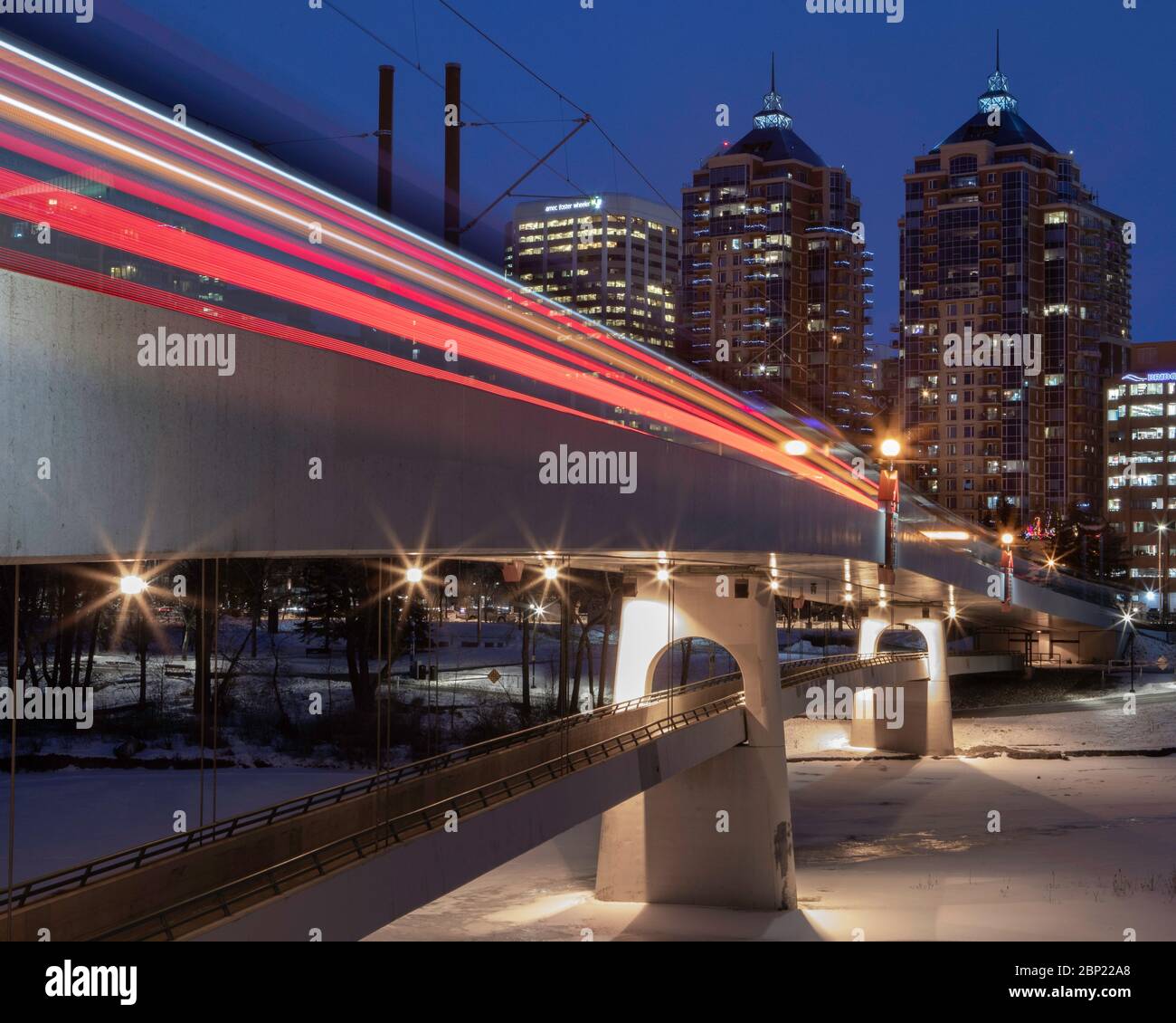 Calgary C-Train entering downtown with colorful light trails Stock ...