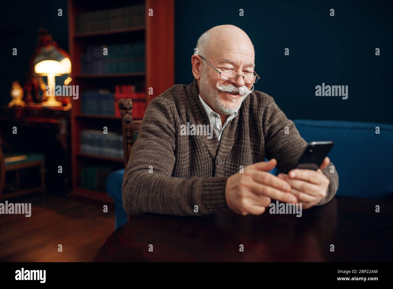 Elderly positive man using mobile hi-res stock photography and images ...