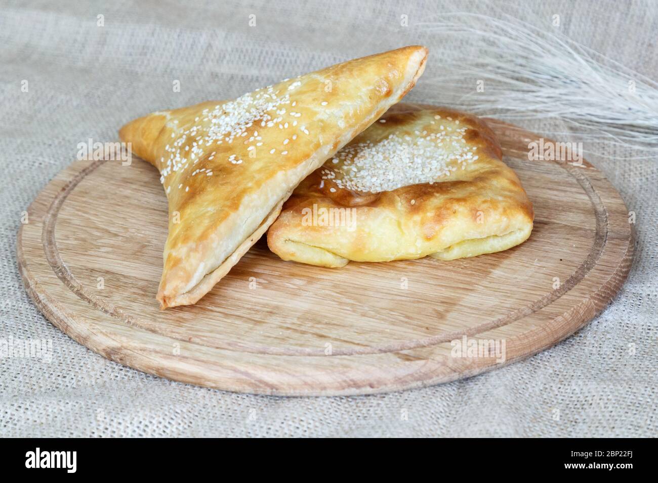 Asian square and triangular samsa with puff pastry sesame seeds on a ...